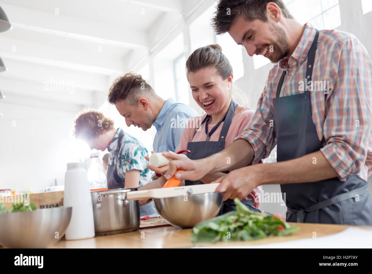 Couple enjoying cooking class in kitchen Stock Photo - Alamy
