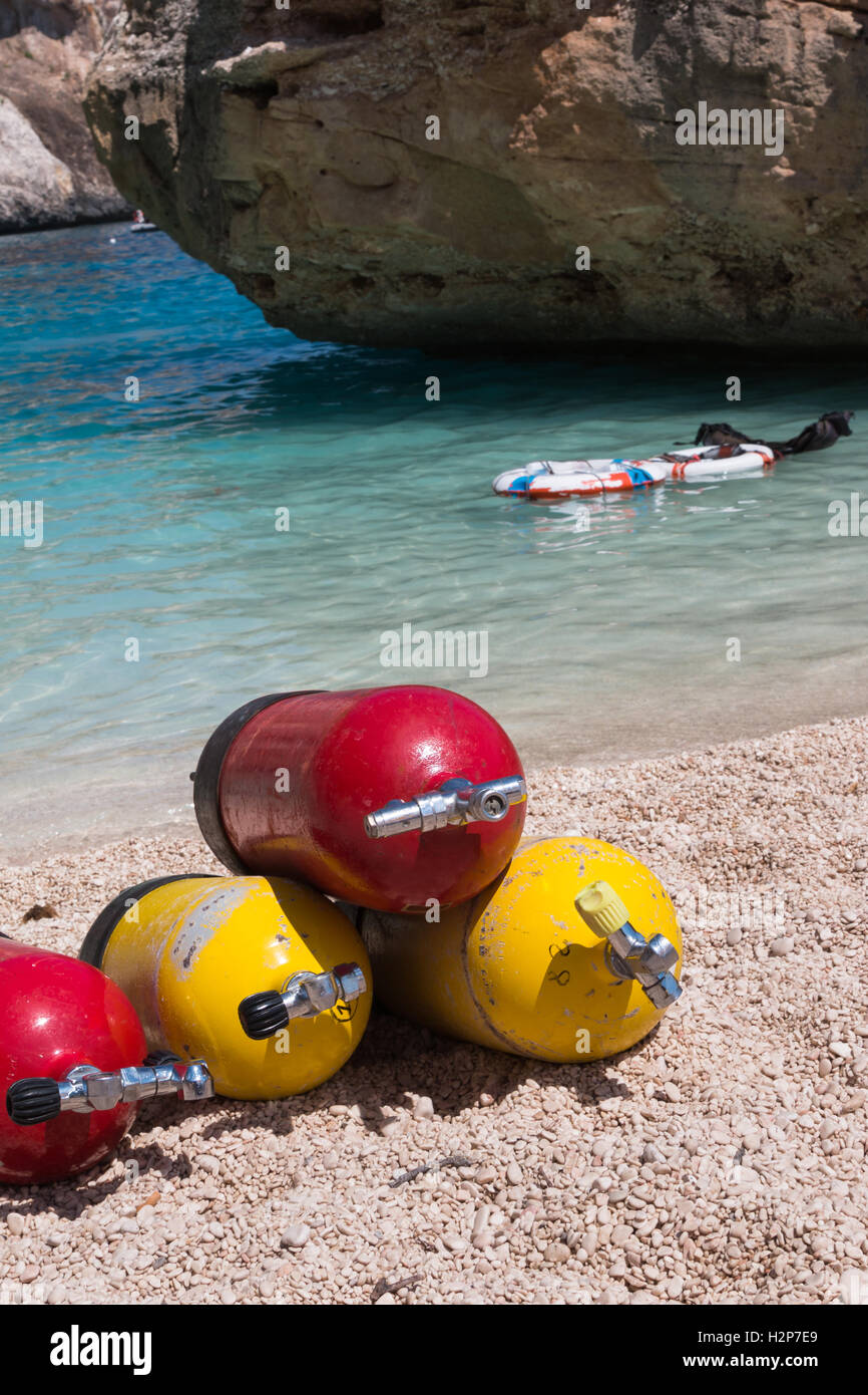 Colorful Scuba Oxygen Tanks for Divers on a Beach Stock Photo - Alamy