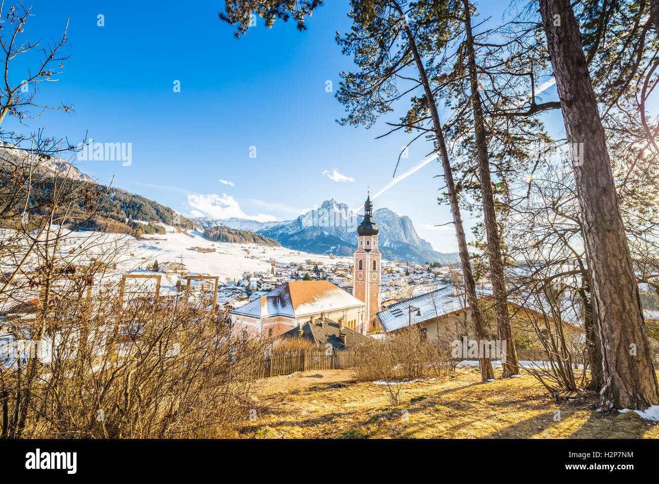 winter Alpine landscape in Italy, mountain village and snowy peaks ...