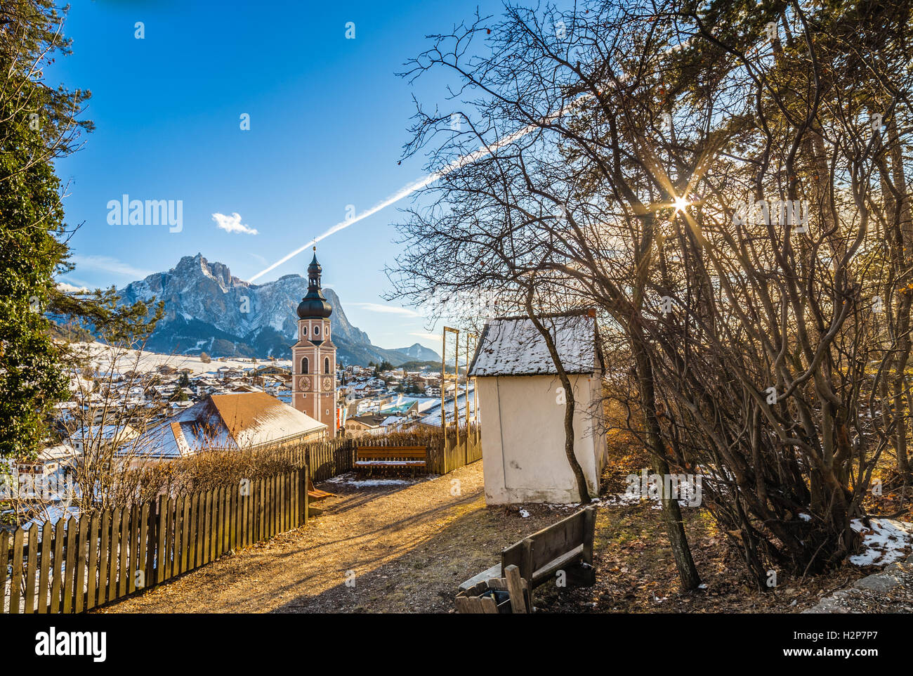 winter Alpine landscape in Italy, mountain village and snowy peaks ...