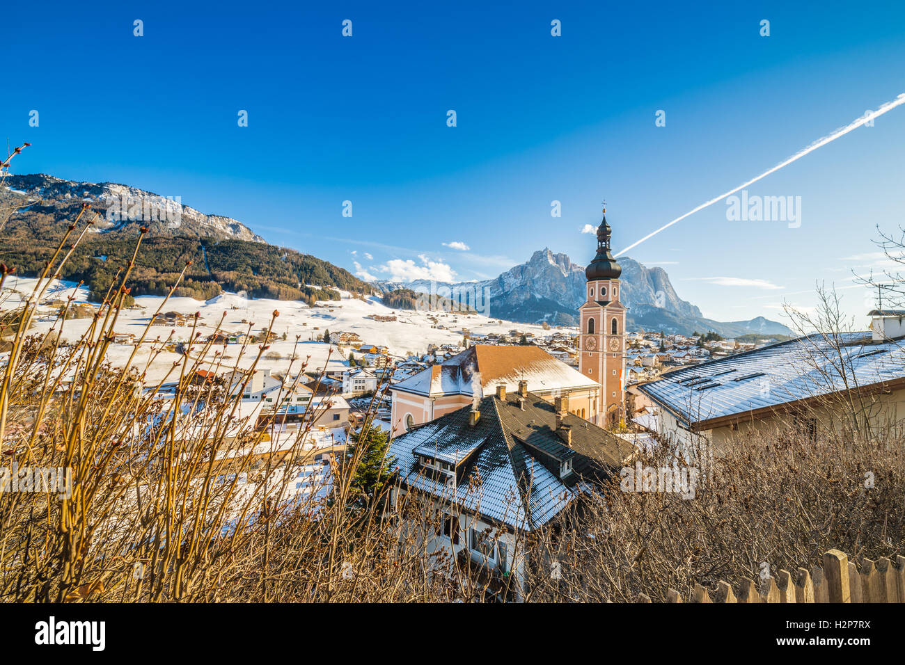 winter Alpine landscape in Italy, mountain village and snowy peaks ...