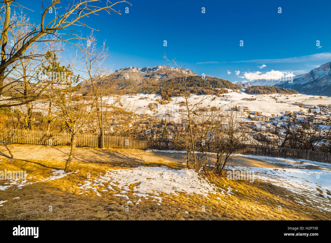 winter Alpine landscape in Italy, mountain village and snowy peaks ...