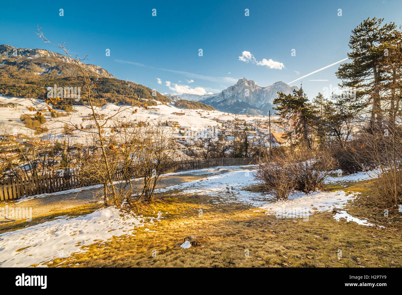 winter Alpine landscape in Italy, mountain village and snowy peaks ...