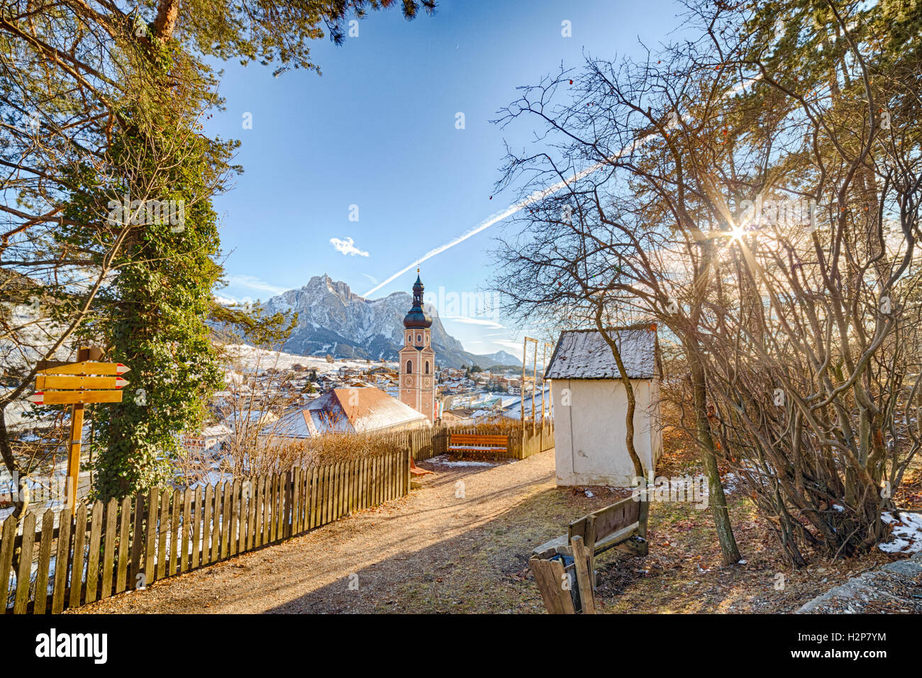 winter Alpine landscape in Italy, mountain village and snowy peaks ...