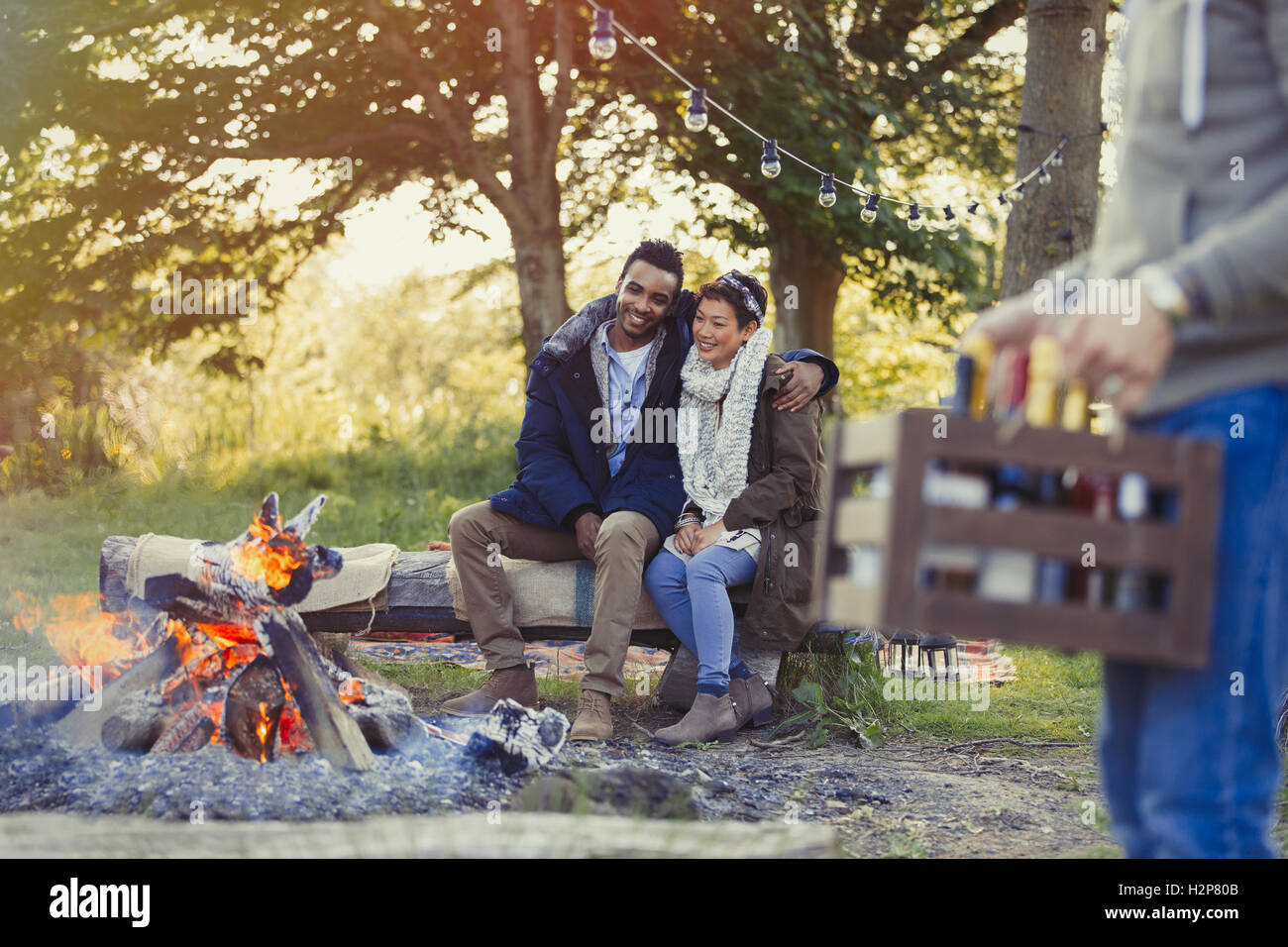 Couple hugging at campfire Stock Photo - Alamy