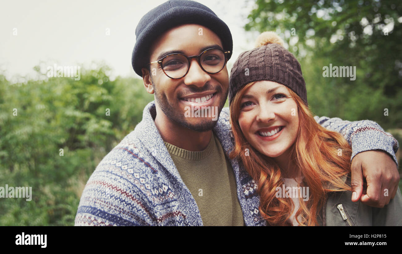Portrait smiling couple hugging Stock Photo - Alamy