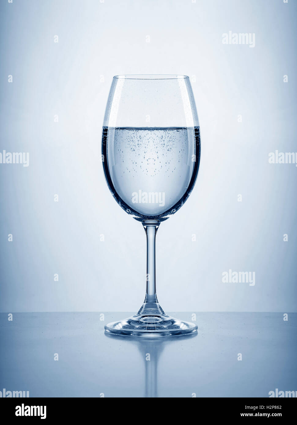 Glass of water on a could background Stock Photo - Alamy
