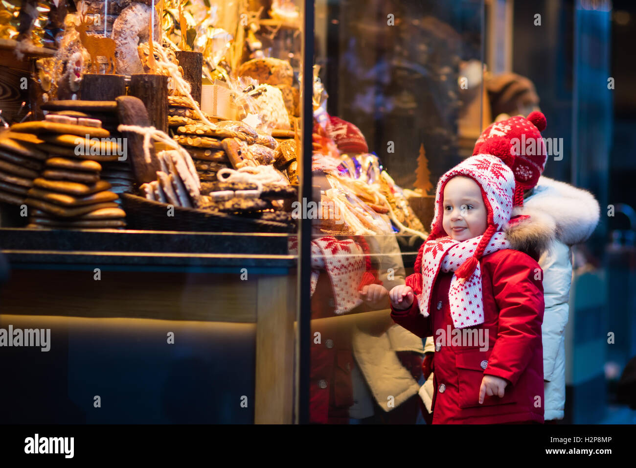 Children window shopping on traditional Christmas market in Germany on ...