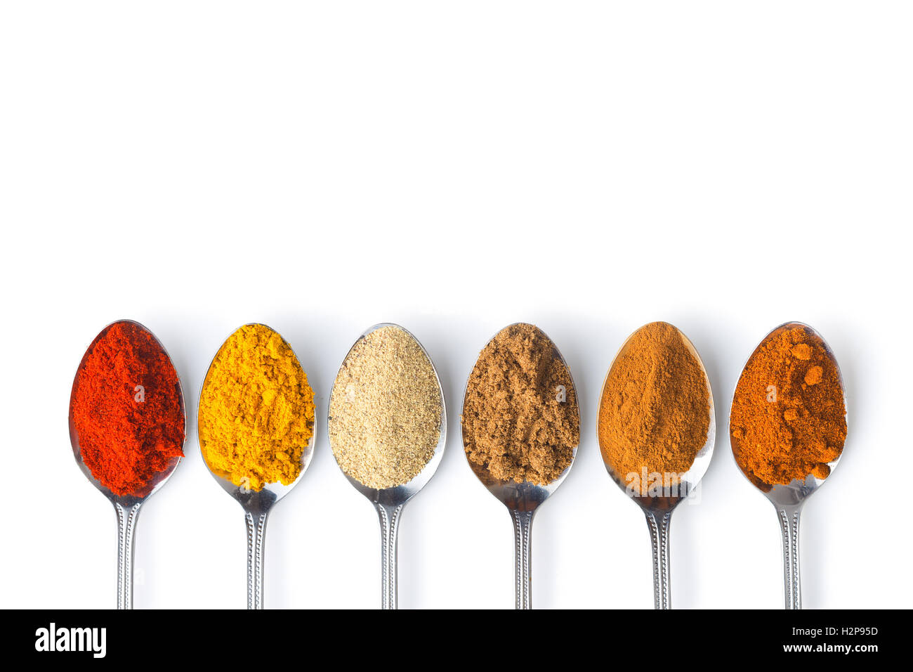 Various spices in spoons isolated on white background Stock Photo - Alamy