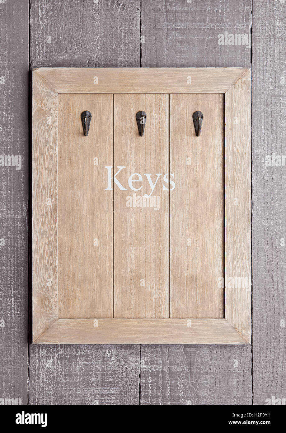 Wooden textured board for keys and messages on wooden background Stock ...