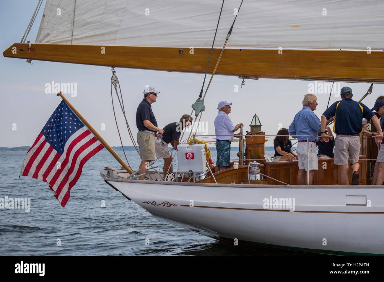 Singer Jimmy Buffett (white shirt), tries his hand at the helm of the U ...