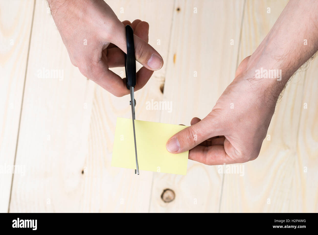 Hand holding cutting fingers hi-res stock photography and images - Alamy