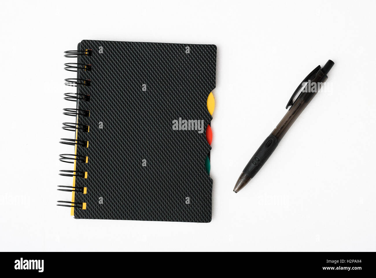notepad with pen isolated Stock Photo - Alamy