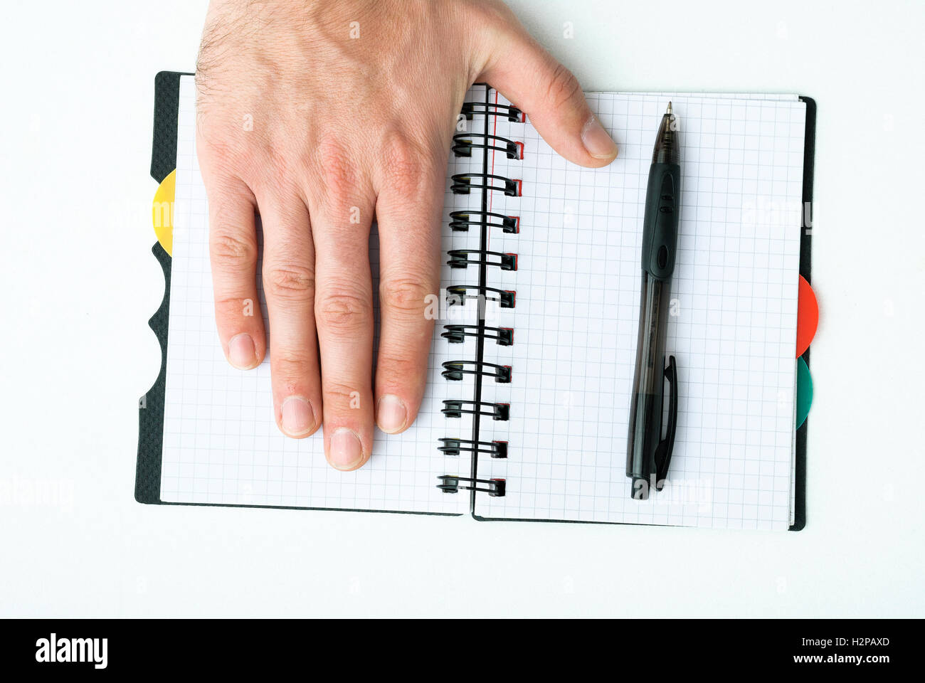 Hand on empty notepad Stock Photo - Alamy