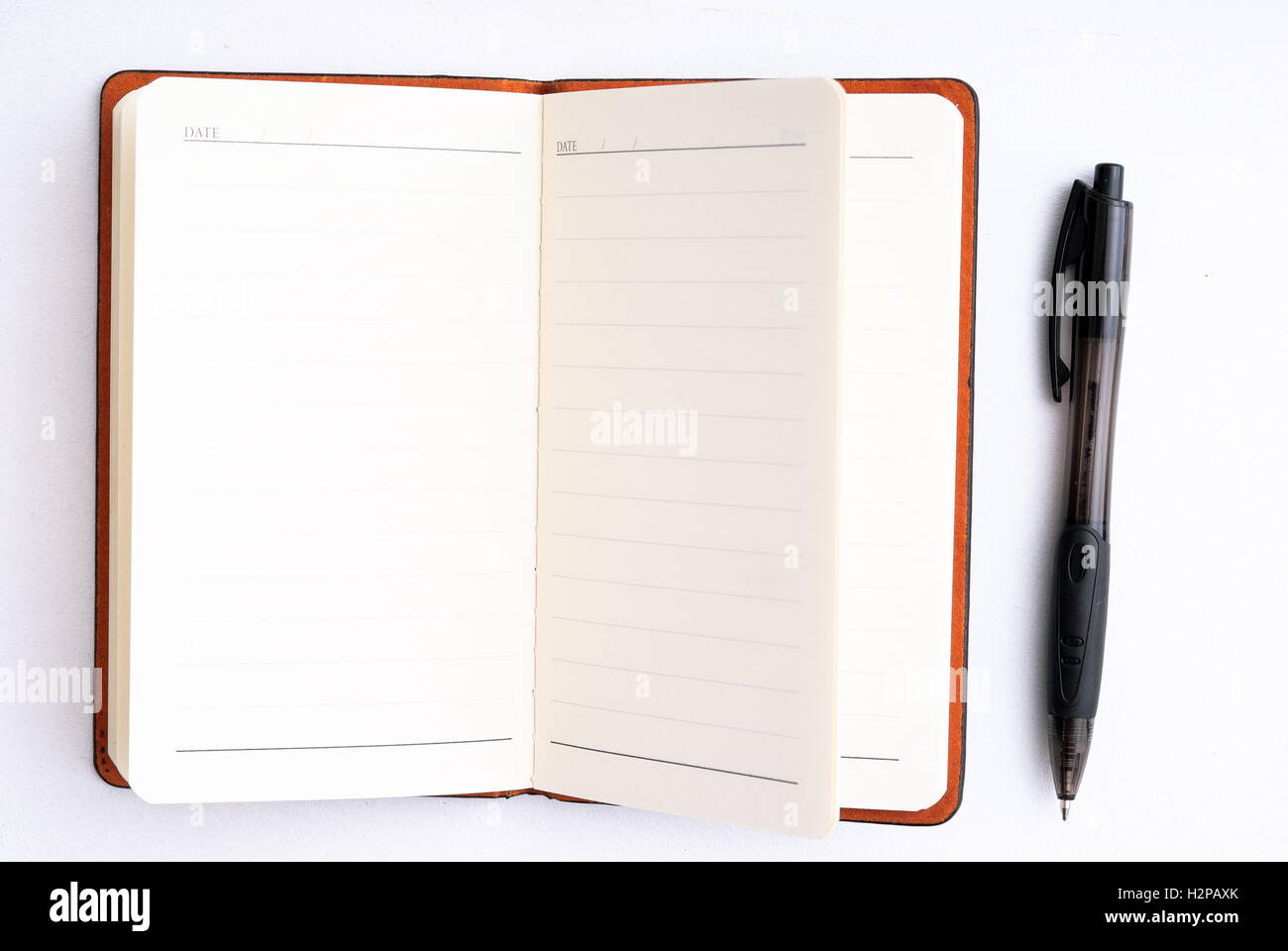 notepad with pen isolated Stock Photo - Alamy