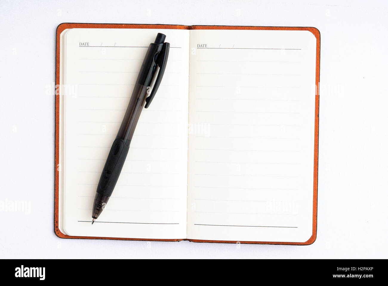 notepad with pen isolated Stock Photo - Alamy