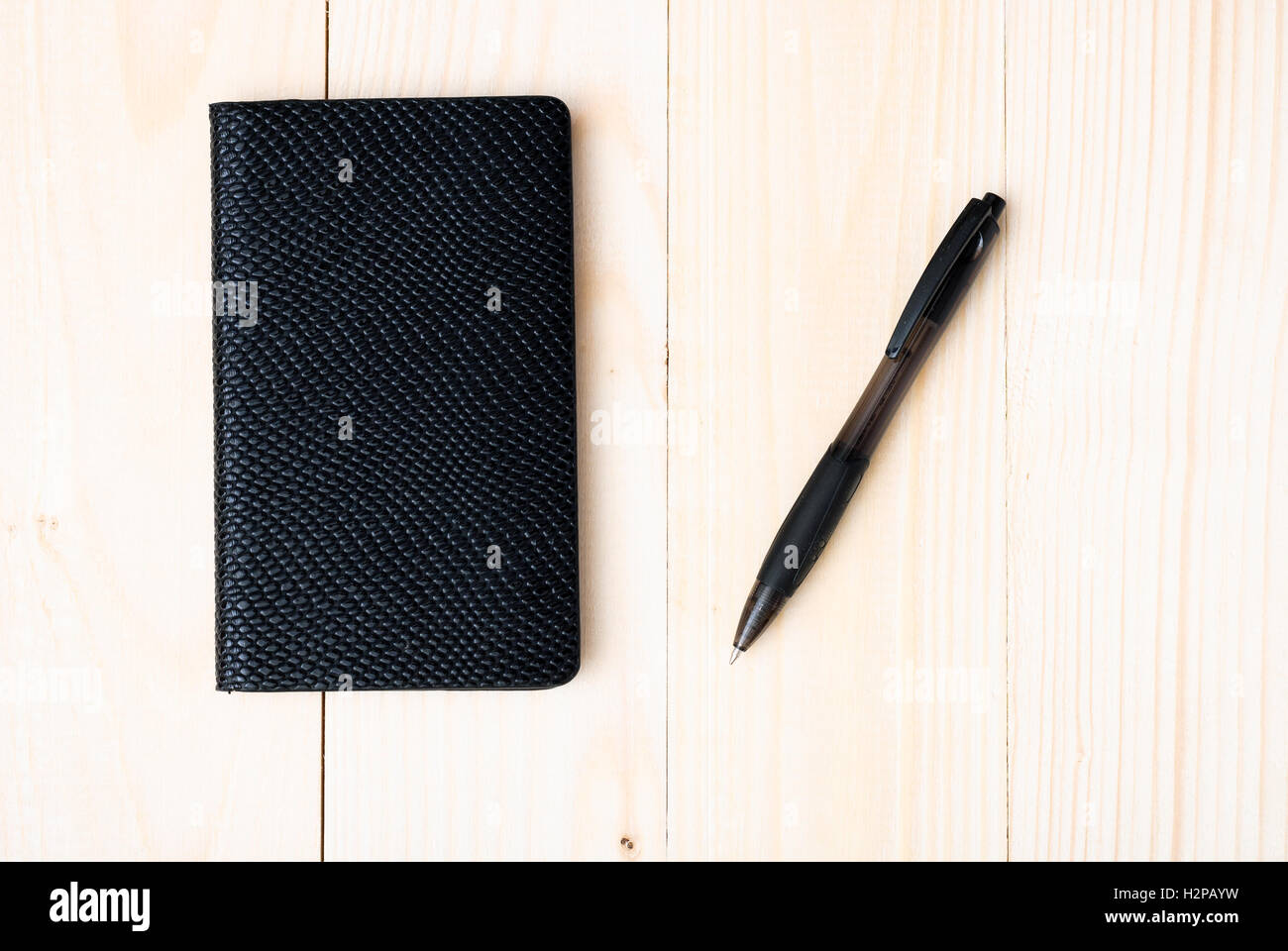 Small notepad with pen Stock Photo - Alamy