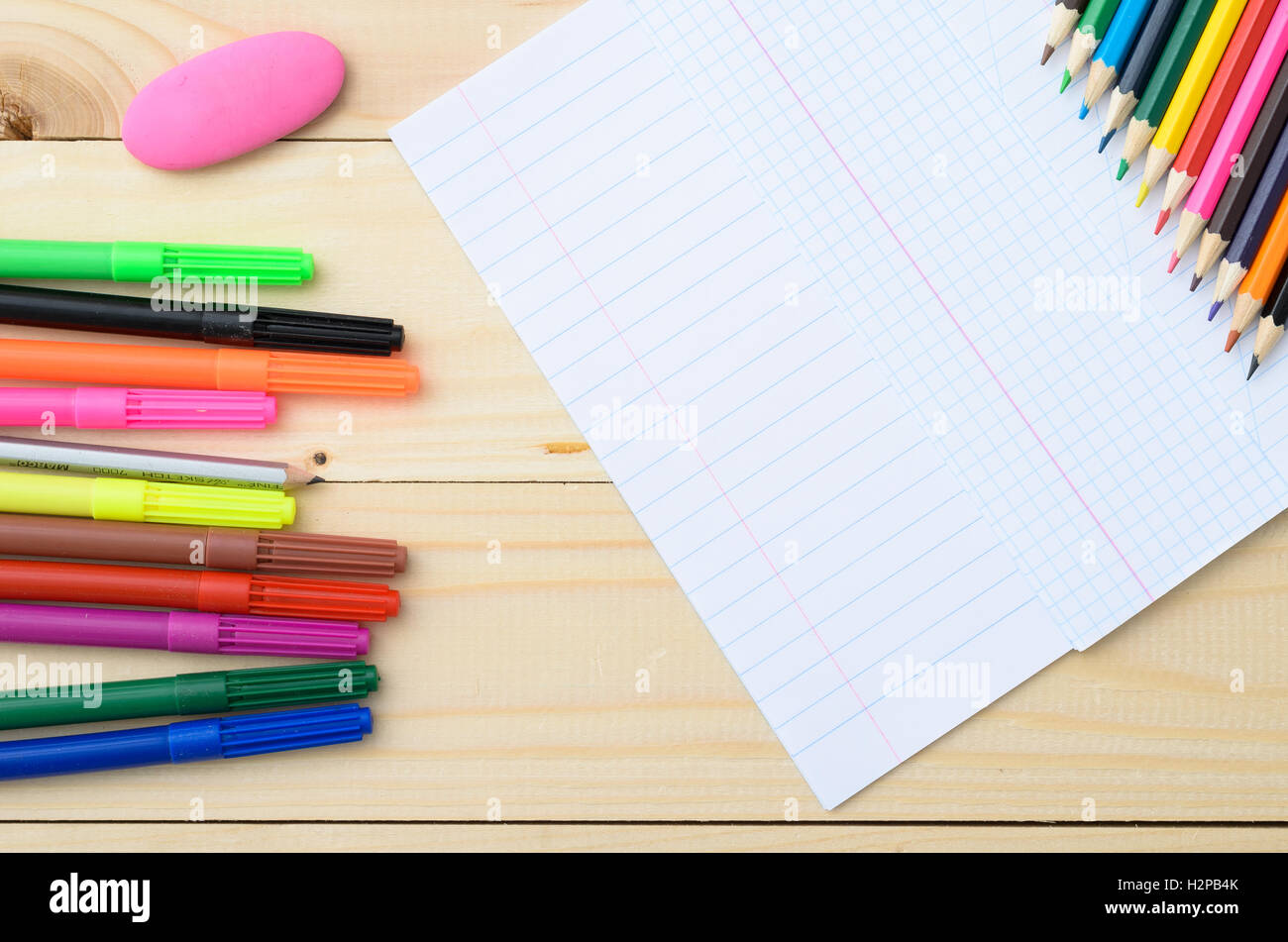 Colored pencils and paper Stock Photo - Alamy