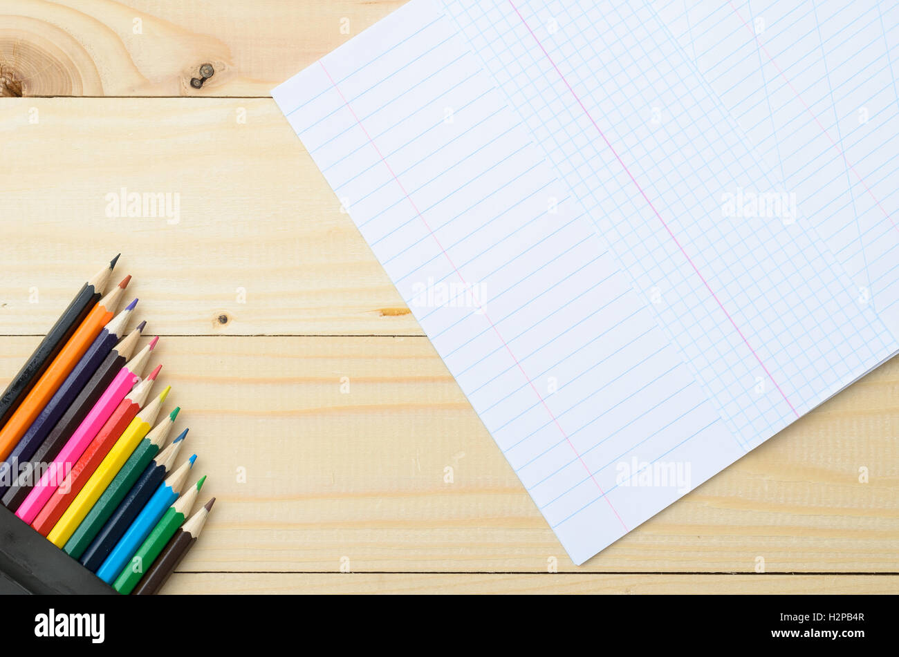 Colored pencils and paper Stock Photo - Alamy