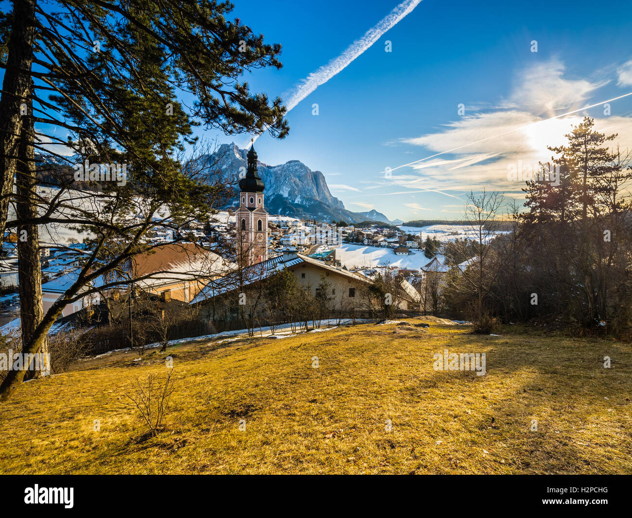 winter Alpine landscape in Italy, mountain village and snowy peaks ...