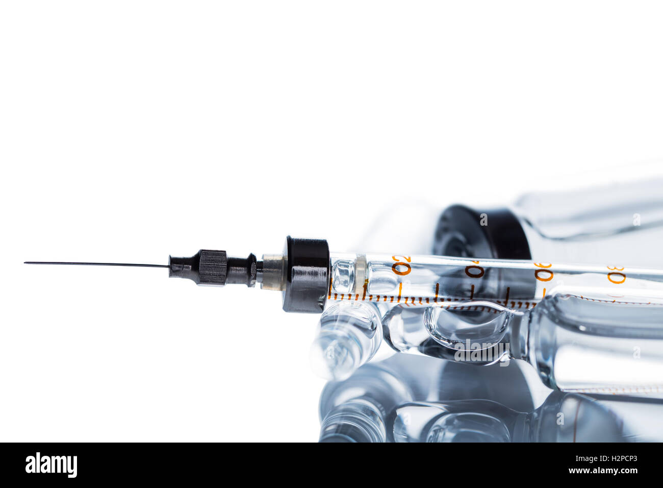 medicament in a glass vial and syringe closeup Stock Photo - Alamy