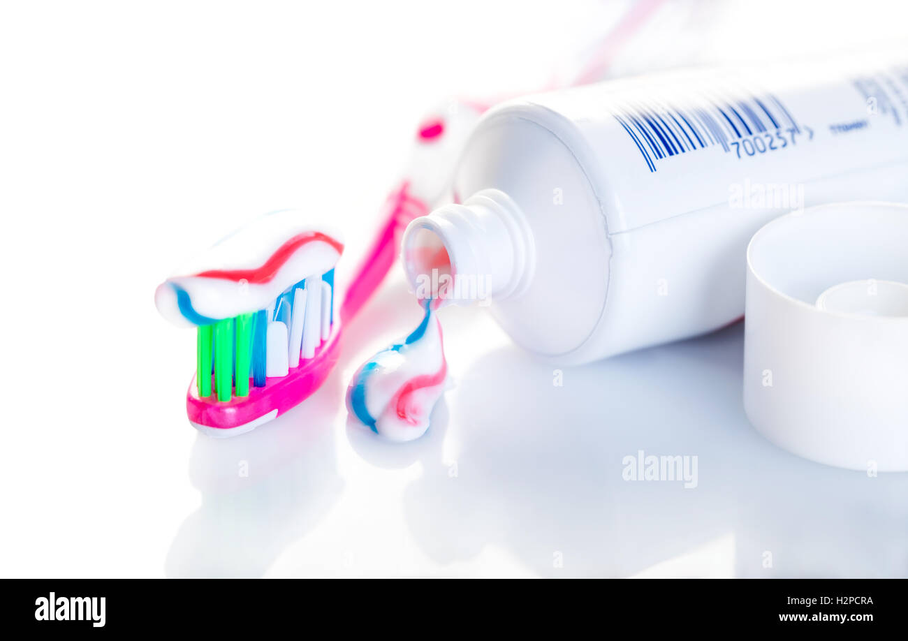 toothbrush with toothpaste close-up on white background Stock Photo - Alamy