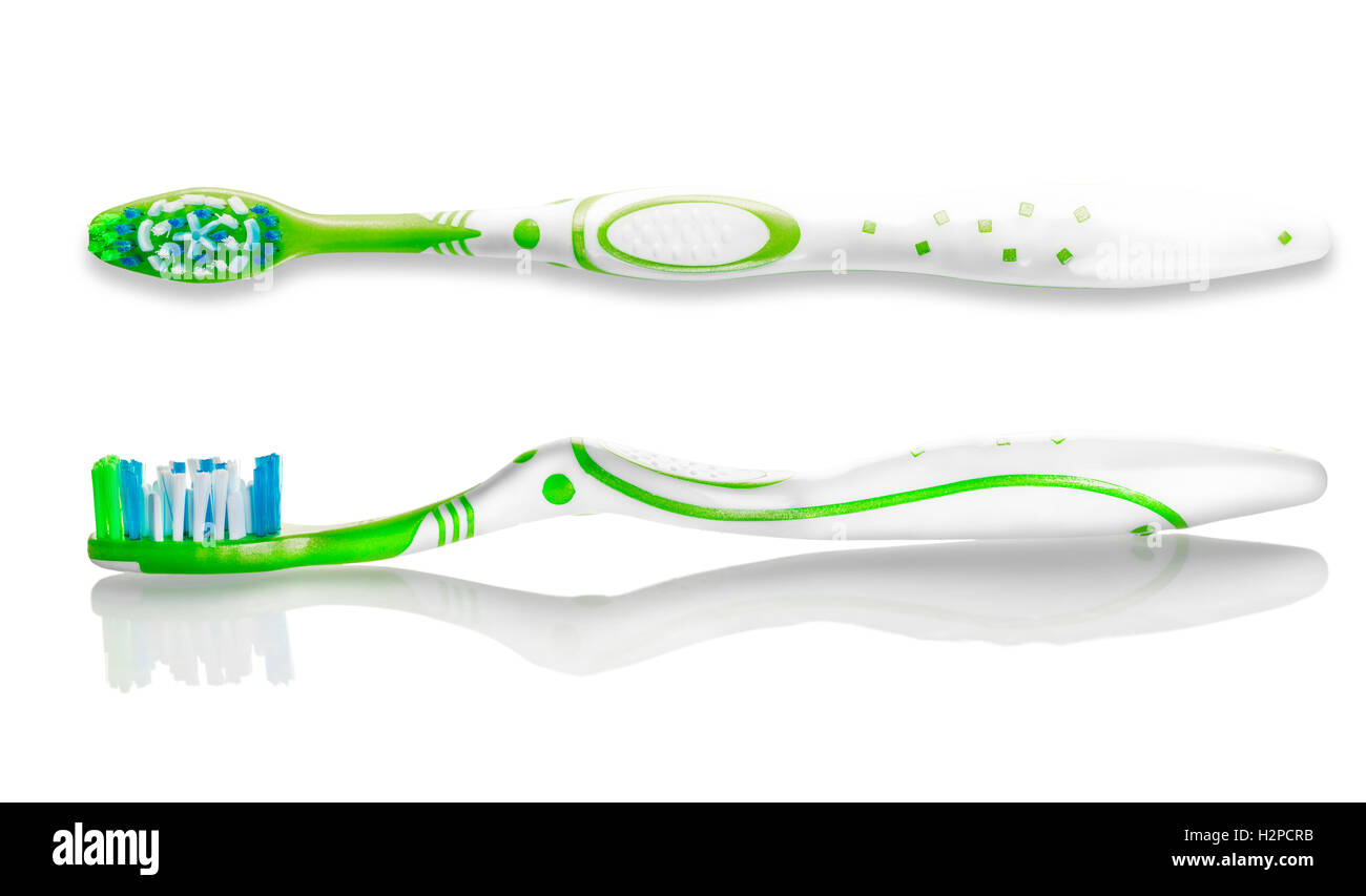 two toothbrushes closeup on against white background Stock Photo - Alamy