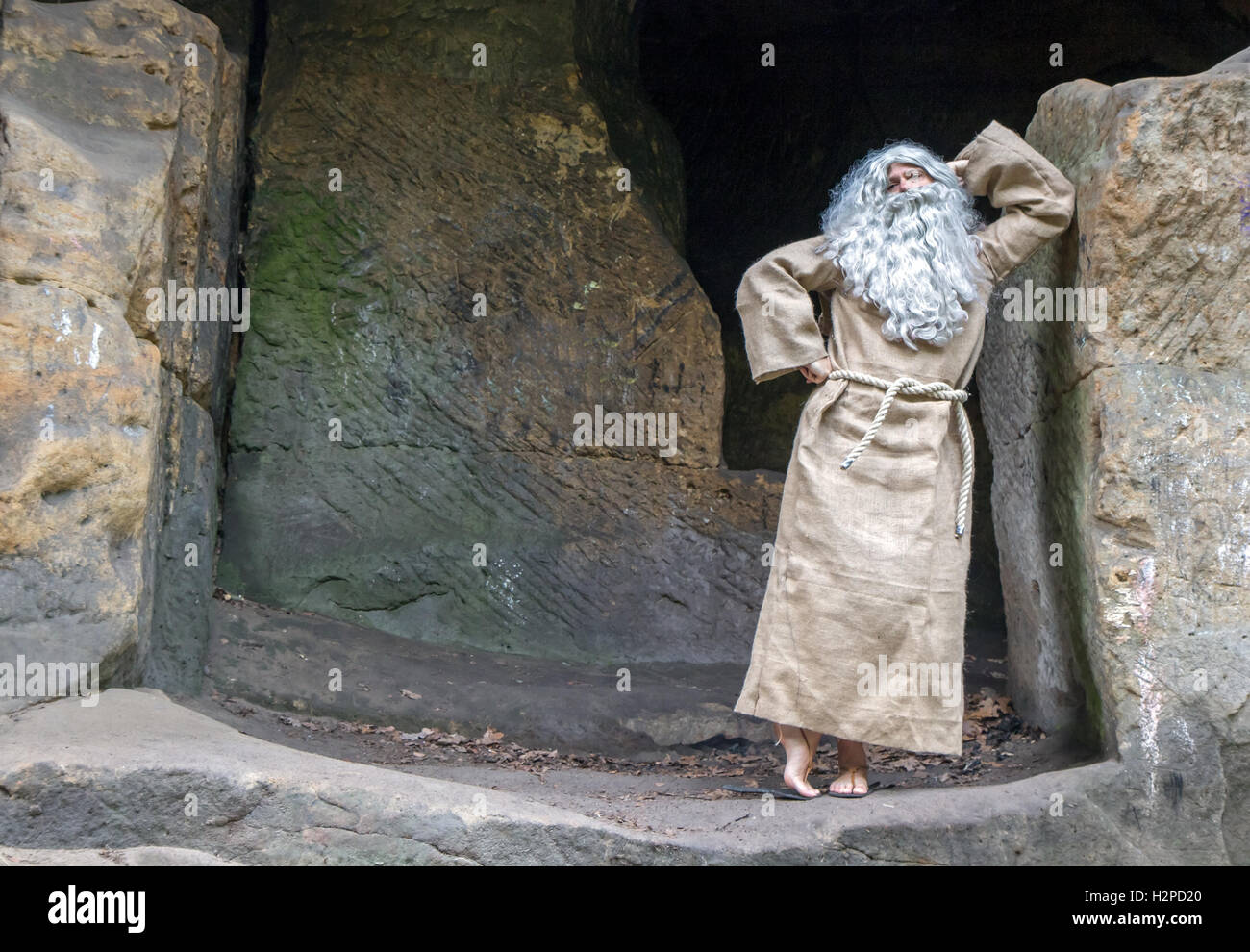The bearded hermit stands in a cave in the rock Stock Photo - Alamy