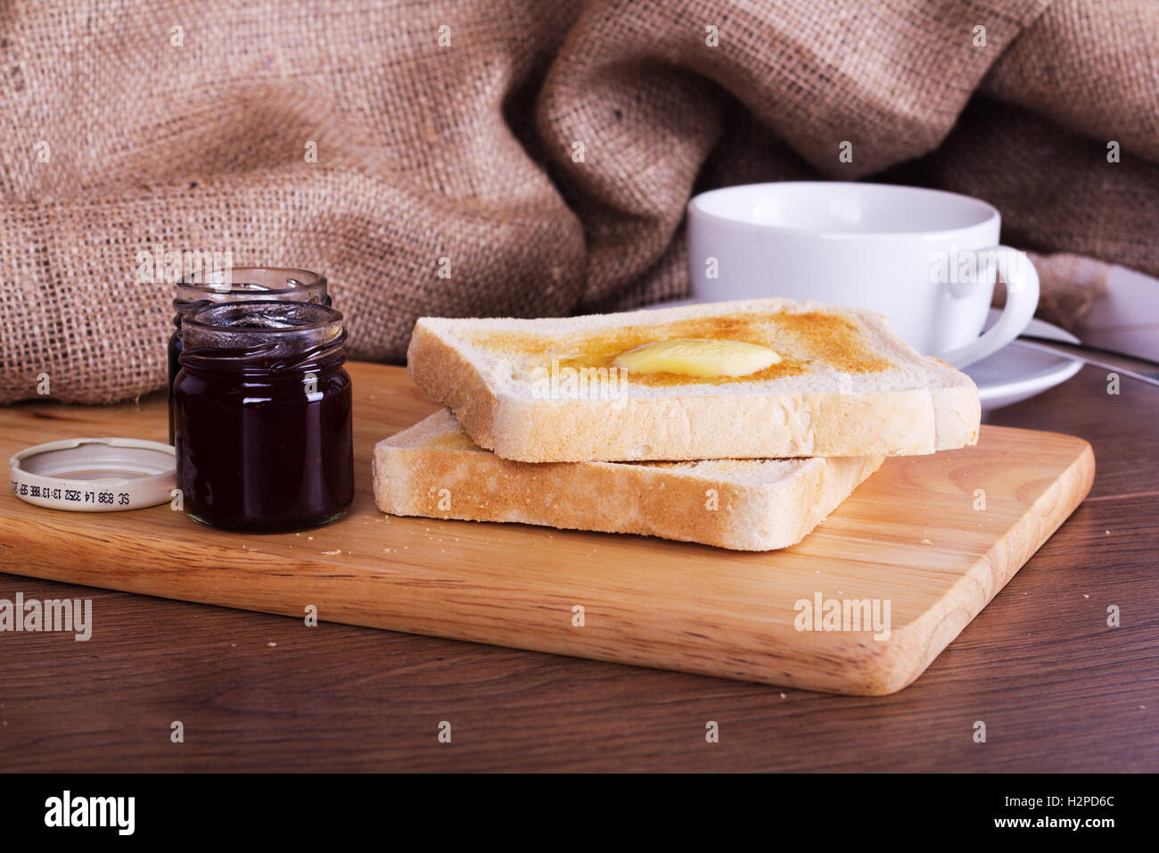 Slices of warm toast against a rustic wooden background Stock Photo - Alamy
