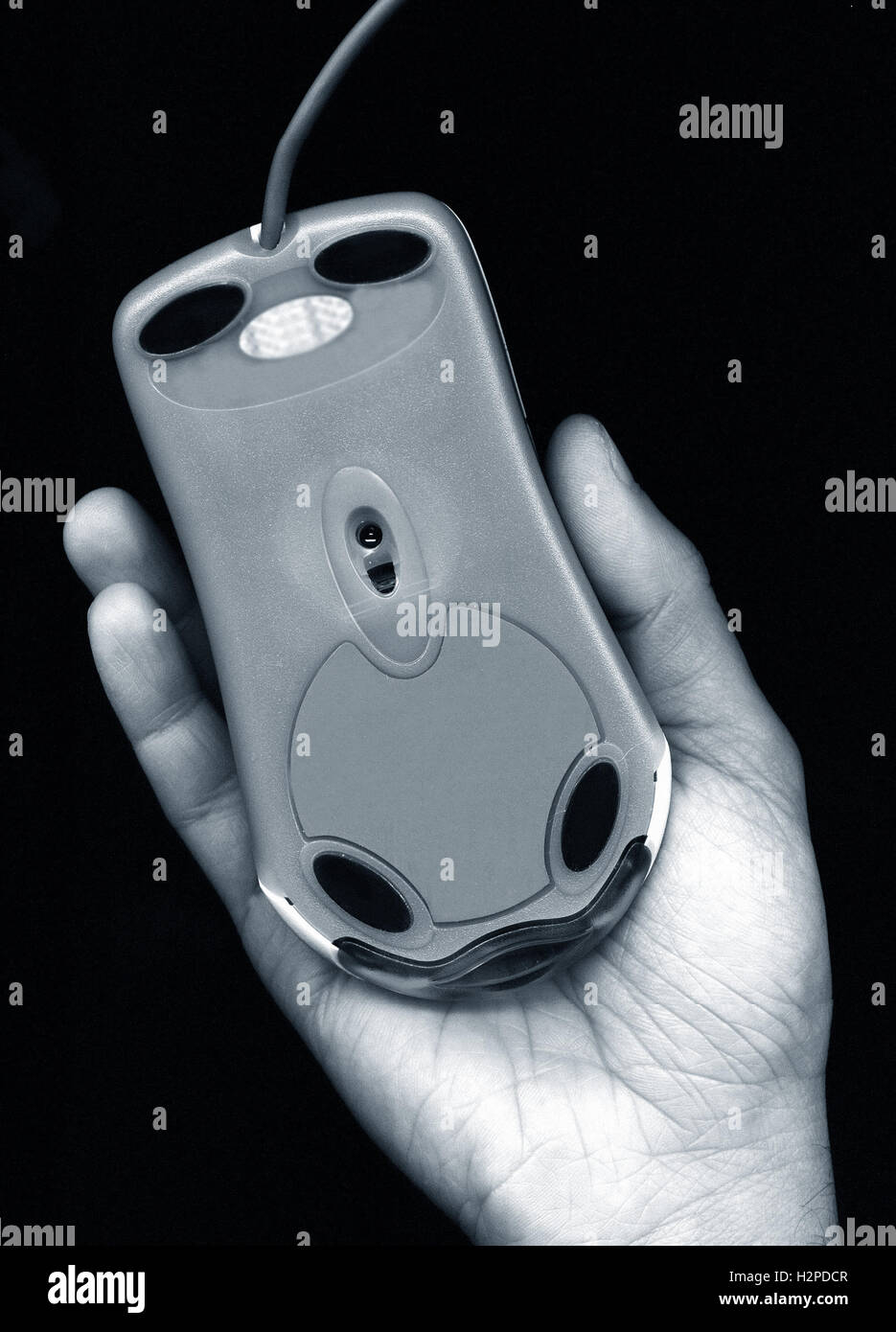 hand on a computer mouse, viewed from below Stock Photo - Alamy