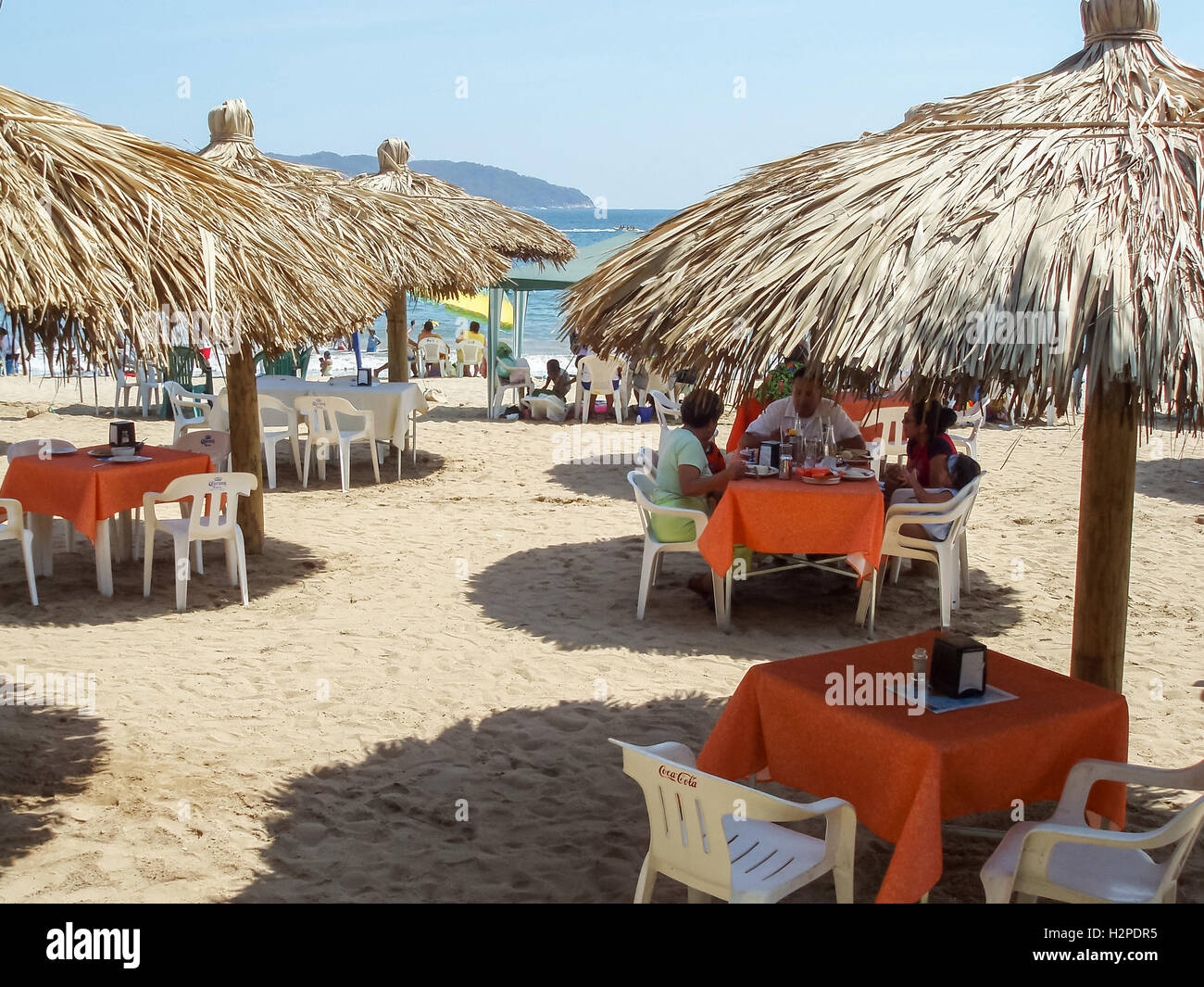 ACAPULCO, MEXICO - MARCH 11, 2006 : People eating at a beach restaurant ...