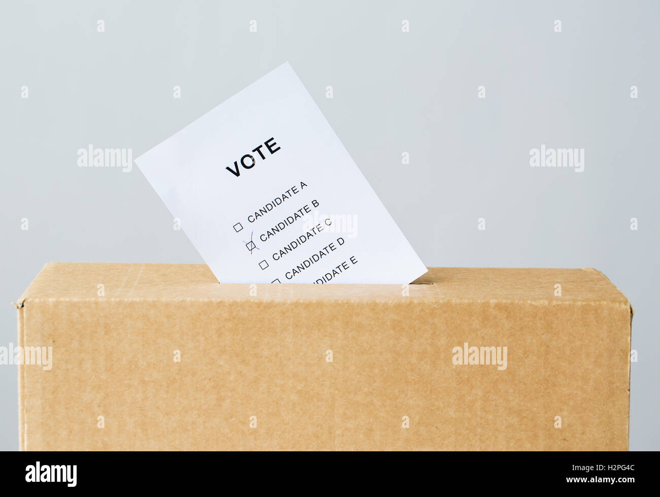 vote inserted into ballot box slot on election Stock Photo - Alamy