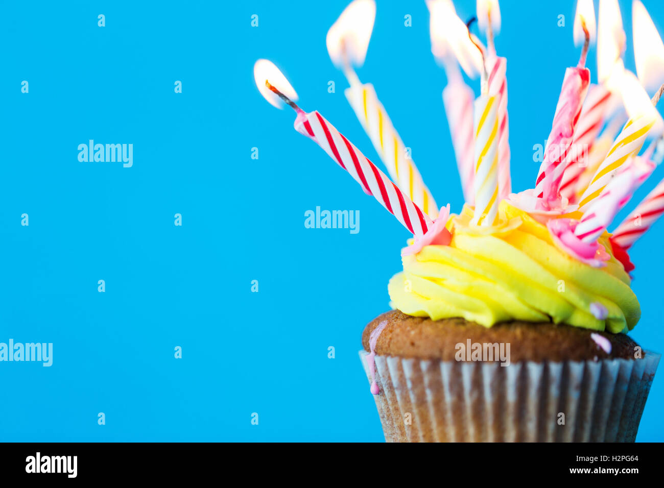 birthday cupcake with many burning candles Stock Photo - Alamy