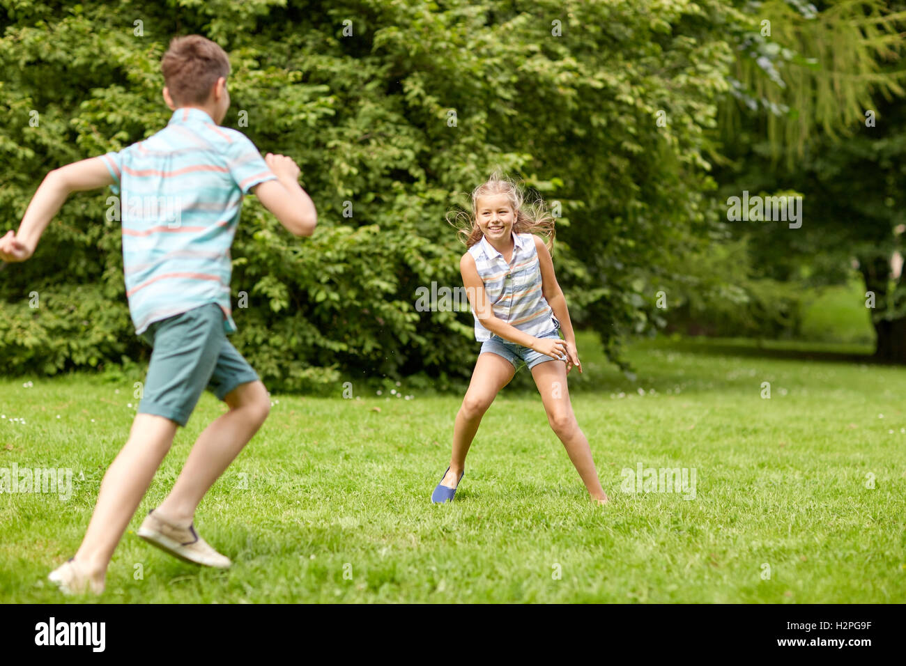 happy kids running and playing game outdoors Stock Photo - Alamy