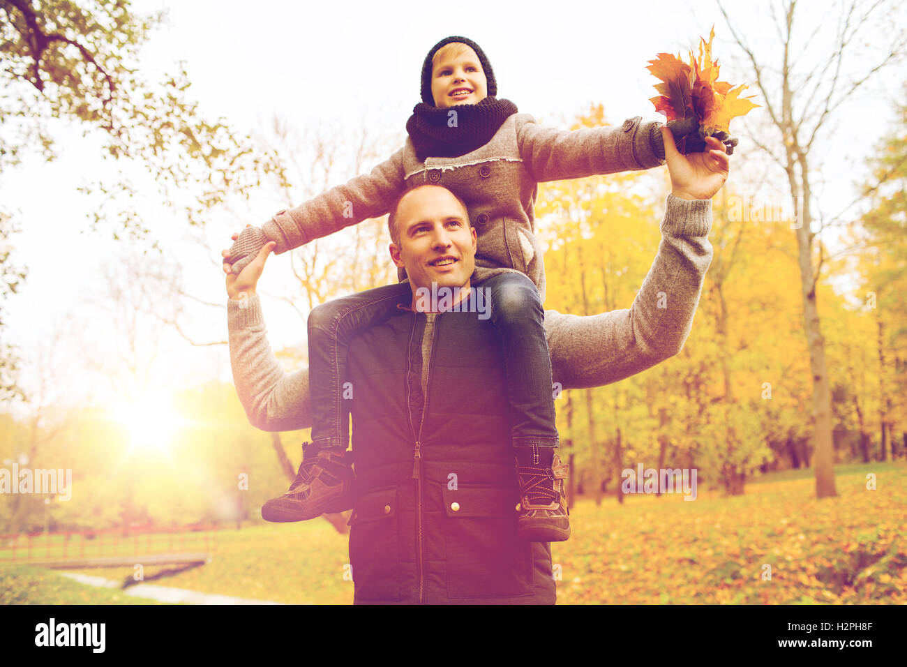 happy family having fun in autumn park Stock Photo - Alamy