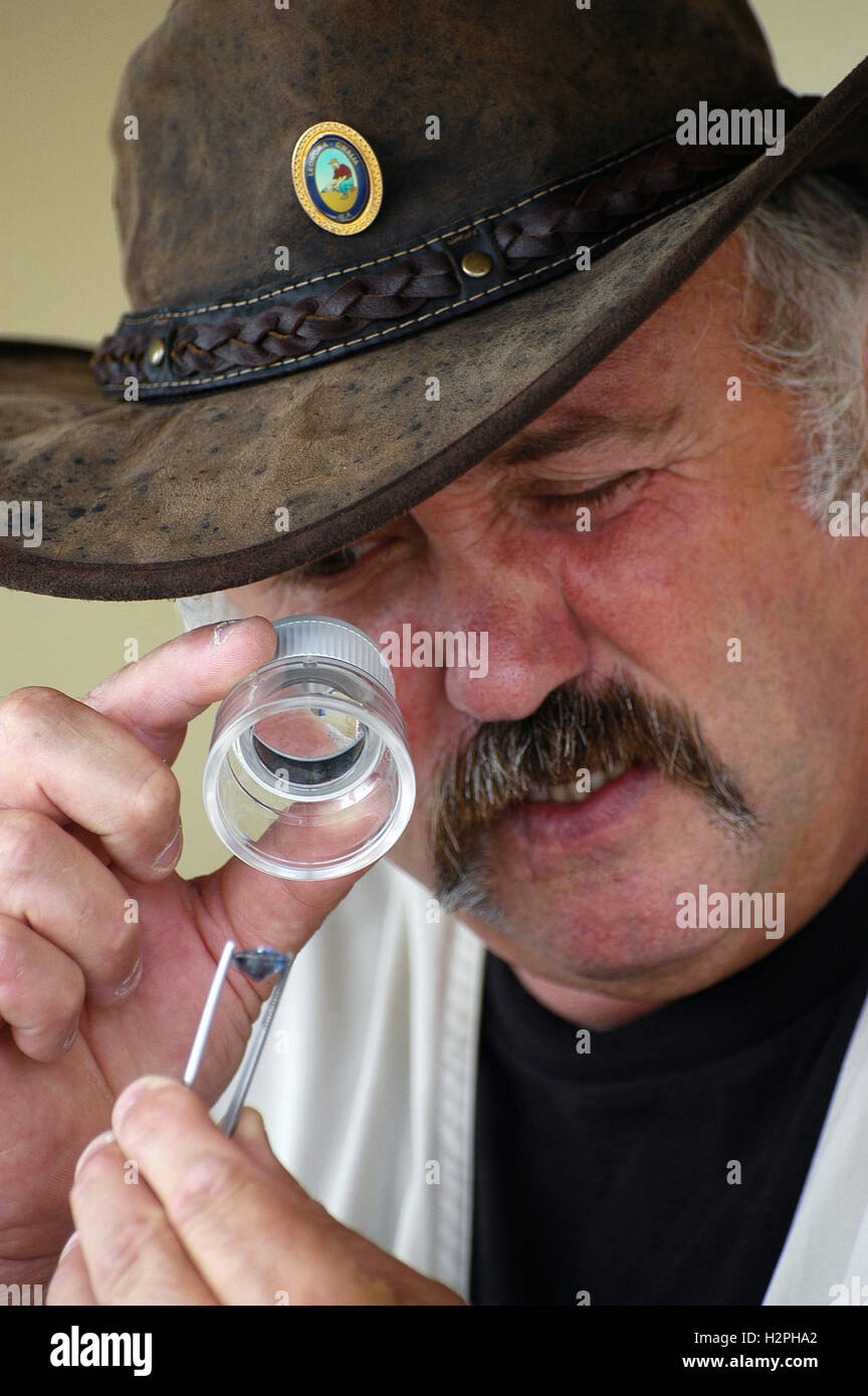 precious stone researcher observing a gem to admire the purity Stock ...