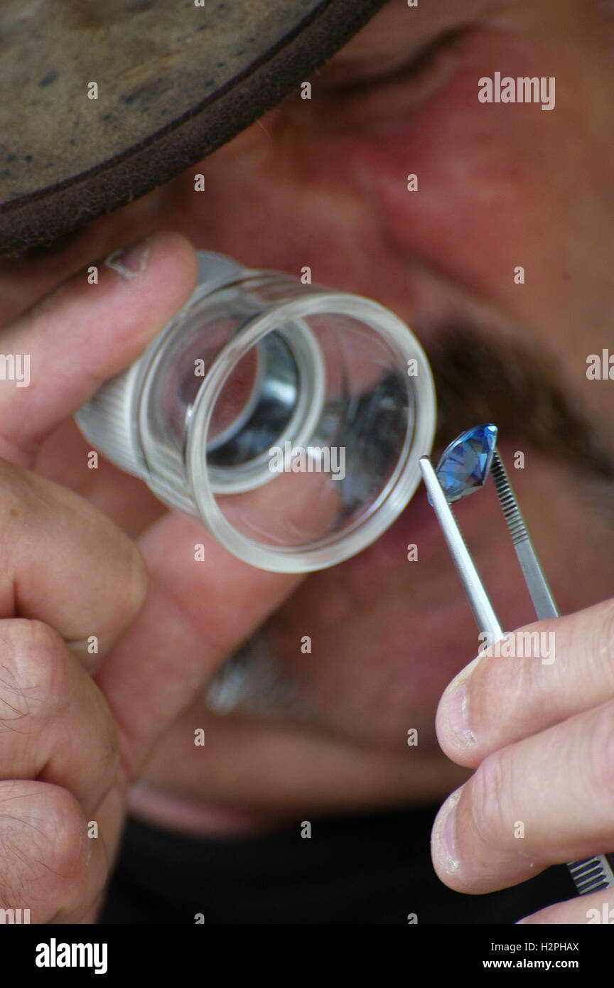 precious stone researcher observing a gem to admire the purity Stock ...