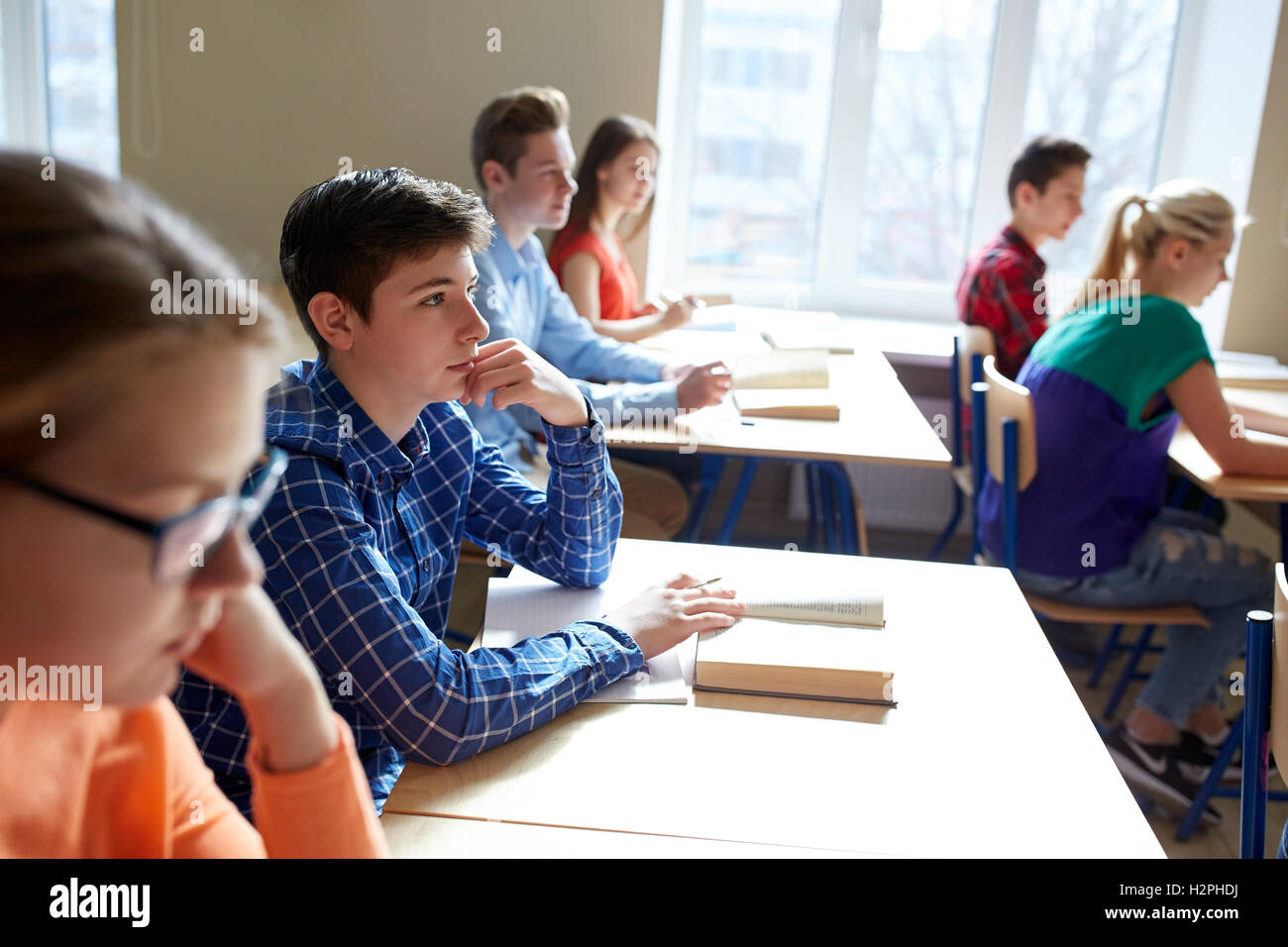 group of students with books at school lesson Stock Photo - Alamy
