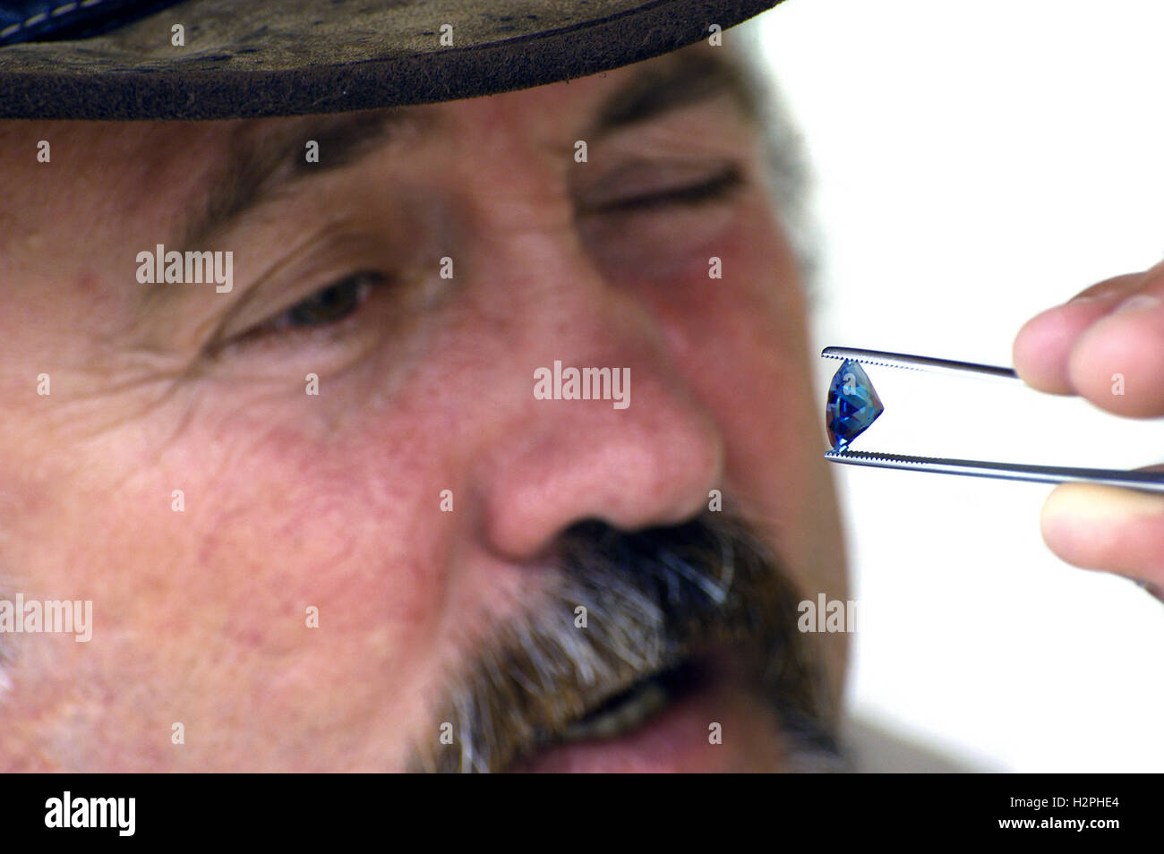 precious stone researcher observing a gem to admire the purity Stock ...