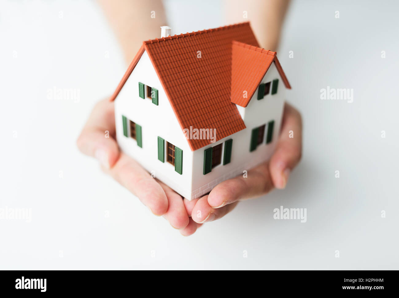 close up of hands with house model Stock Photo - Alamy