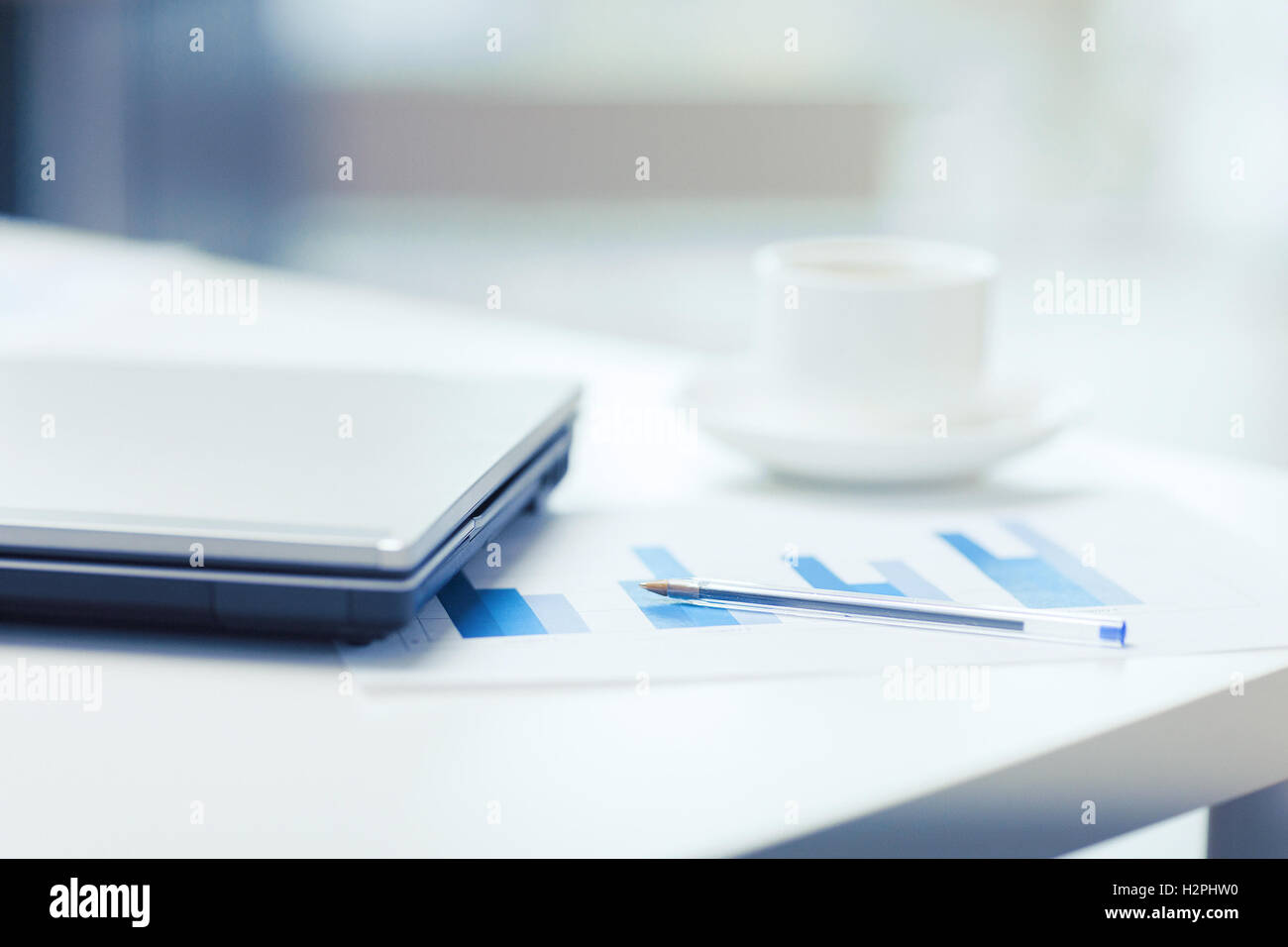 close up of laptop computer, charts and coffee Stock Photo - Alamy