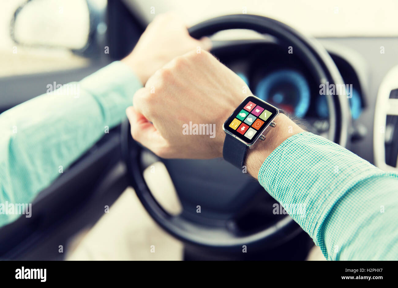close up of man with app on smartwatch driving car Stock Photo - Alamy
