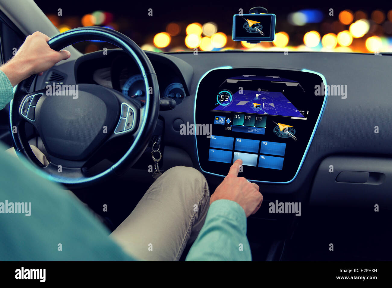 close up of man driving car with navigation system Stock Photo - Alamy