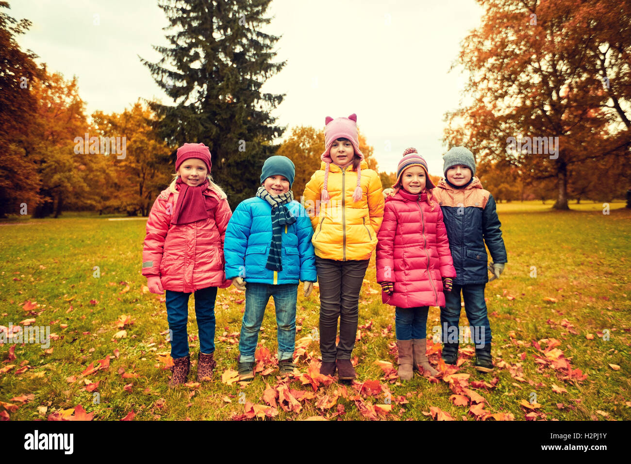 group of happy children in autumn park Stock Photo - Alamy