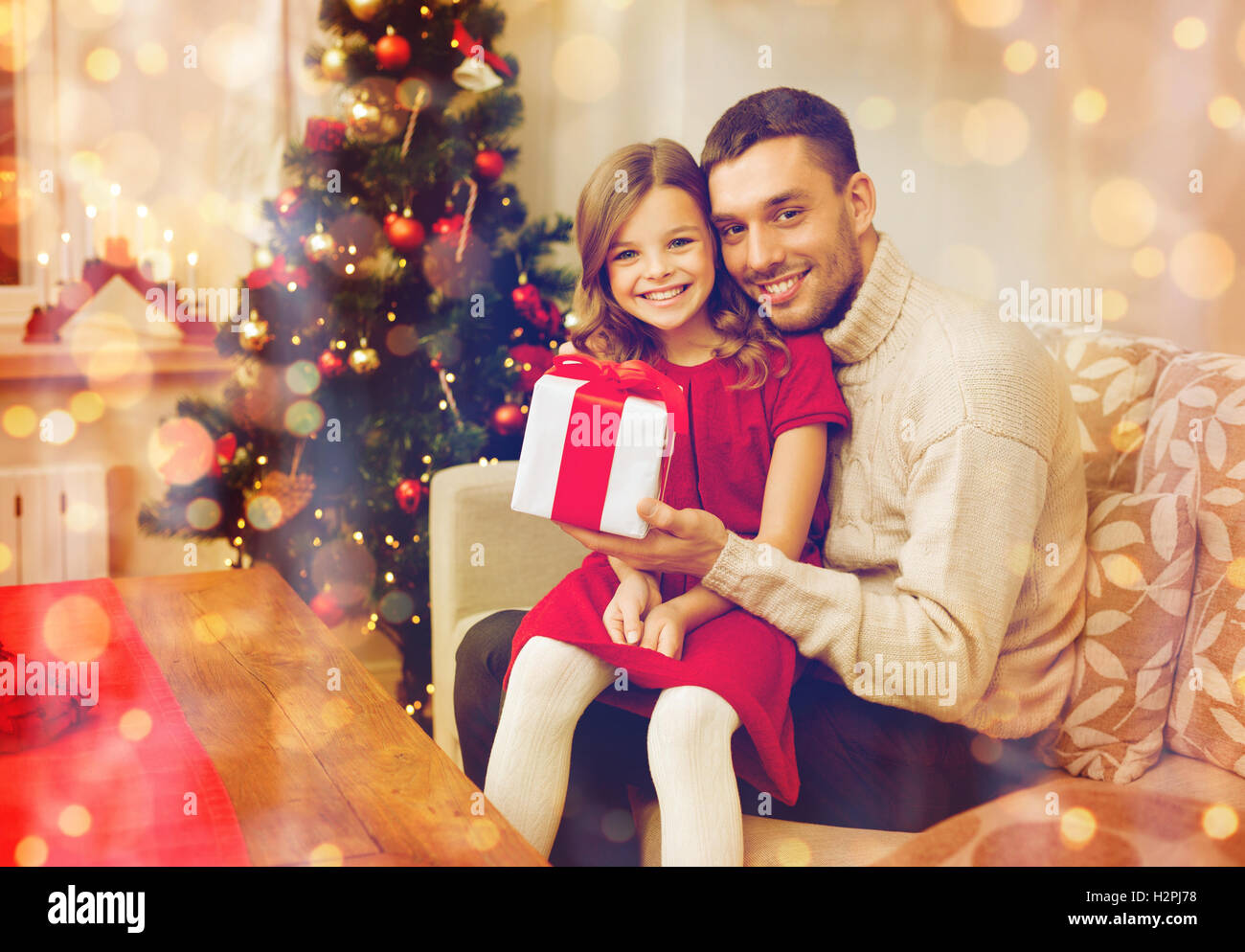 smiling father and daughter holding gift box Stock Photo - Alamy