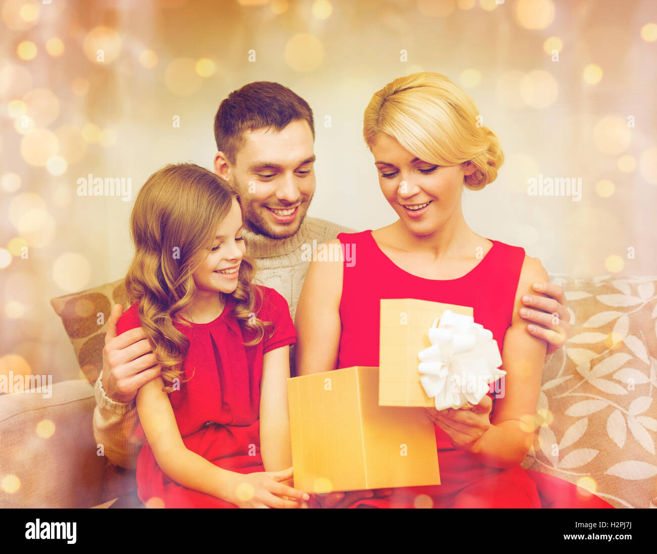 happy family opening gift box Stock Photo - Alamy
