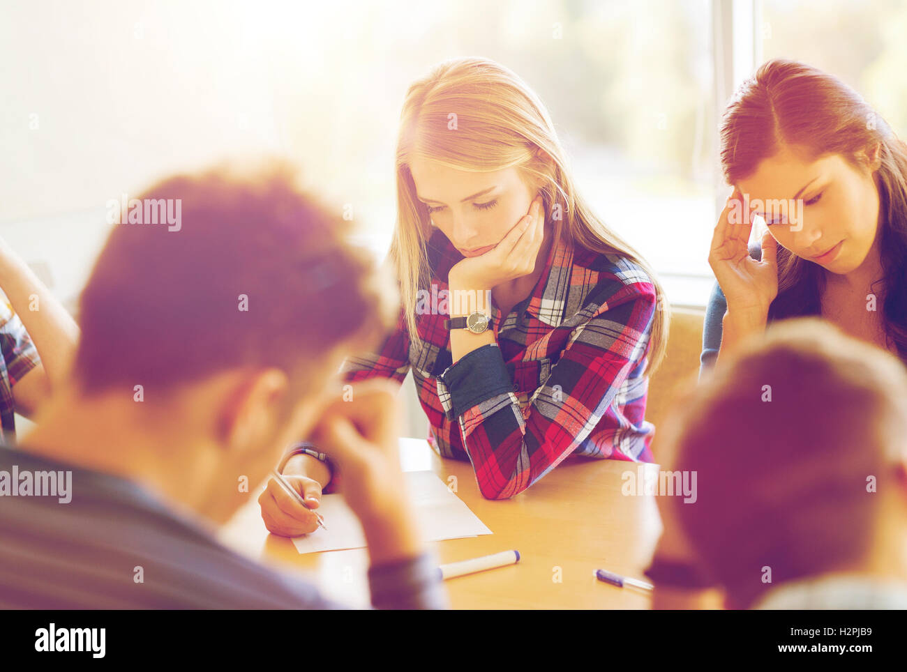 group of students with papers Stock Photo - Alamy