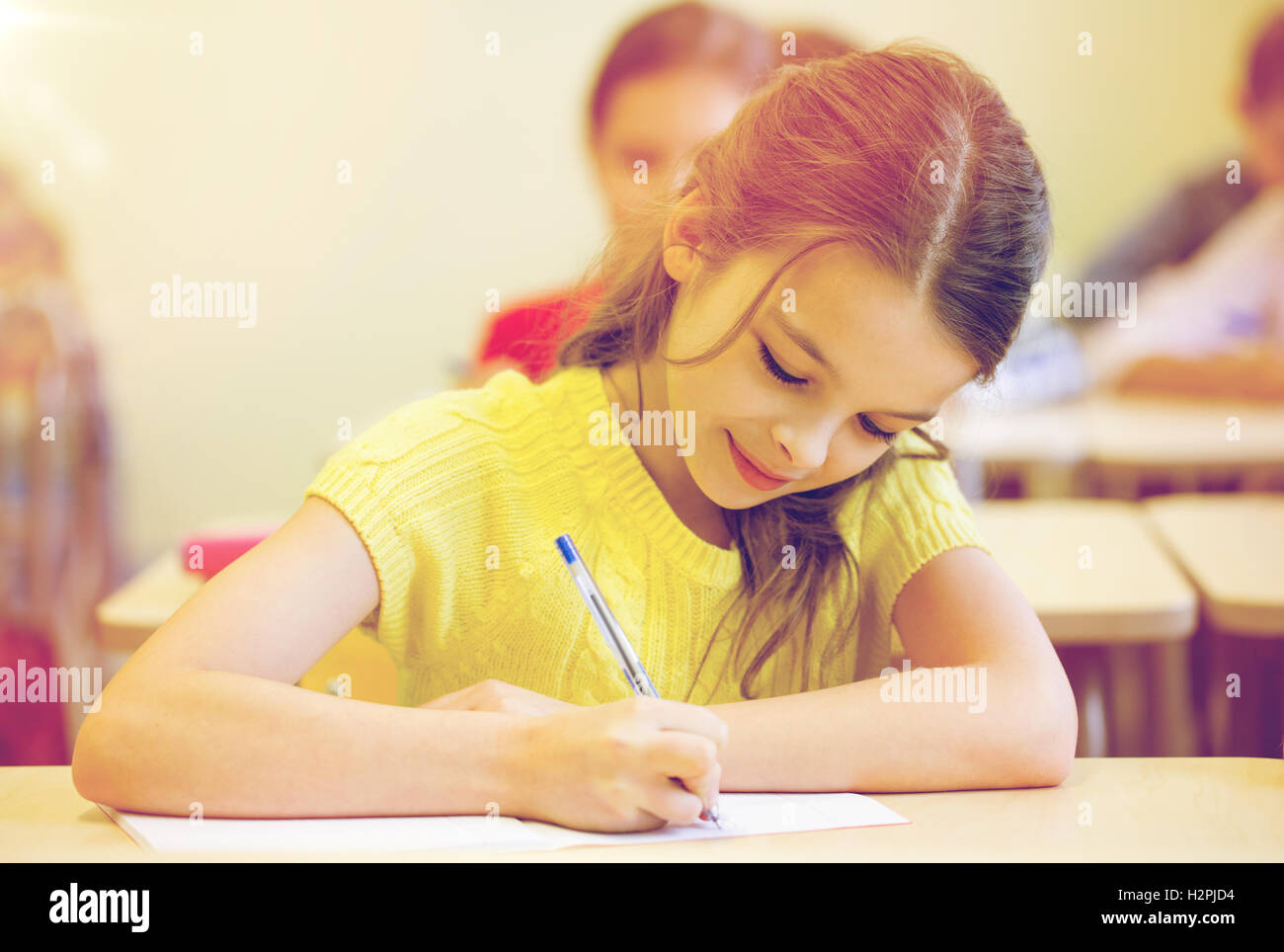 group of school kids writing test in classroom Stock Photo - Alamy