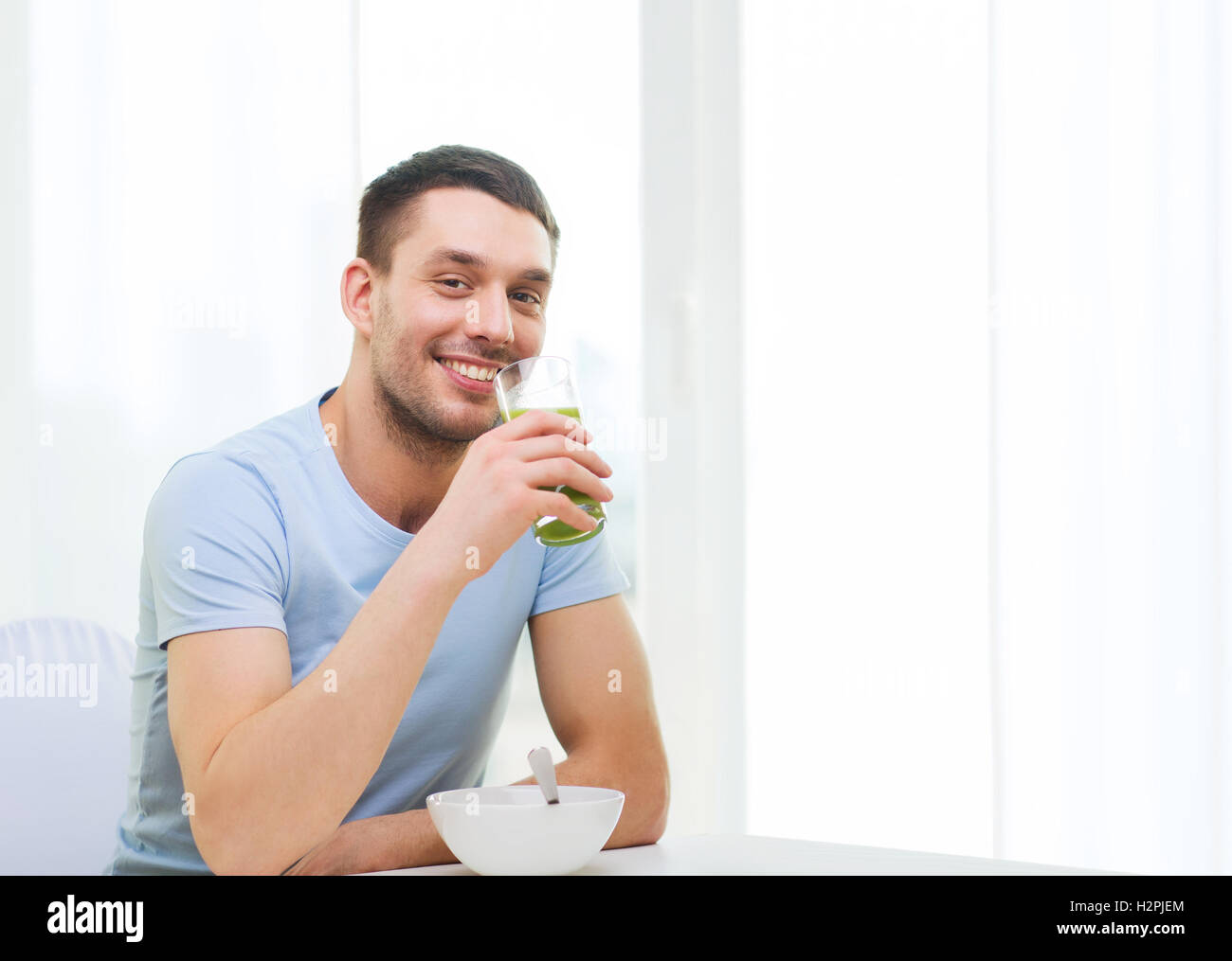 happy man having breakfast at home Stock Photo - Alamy