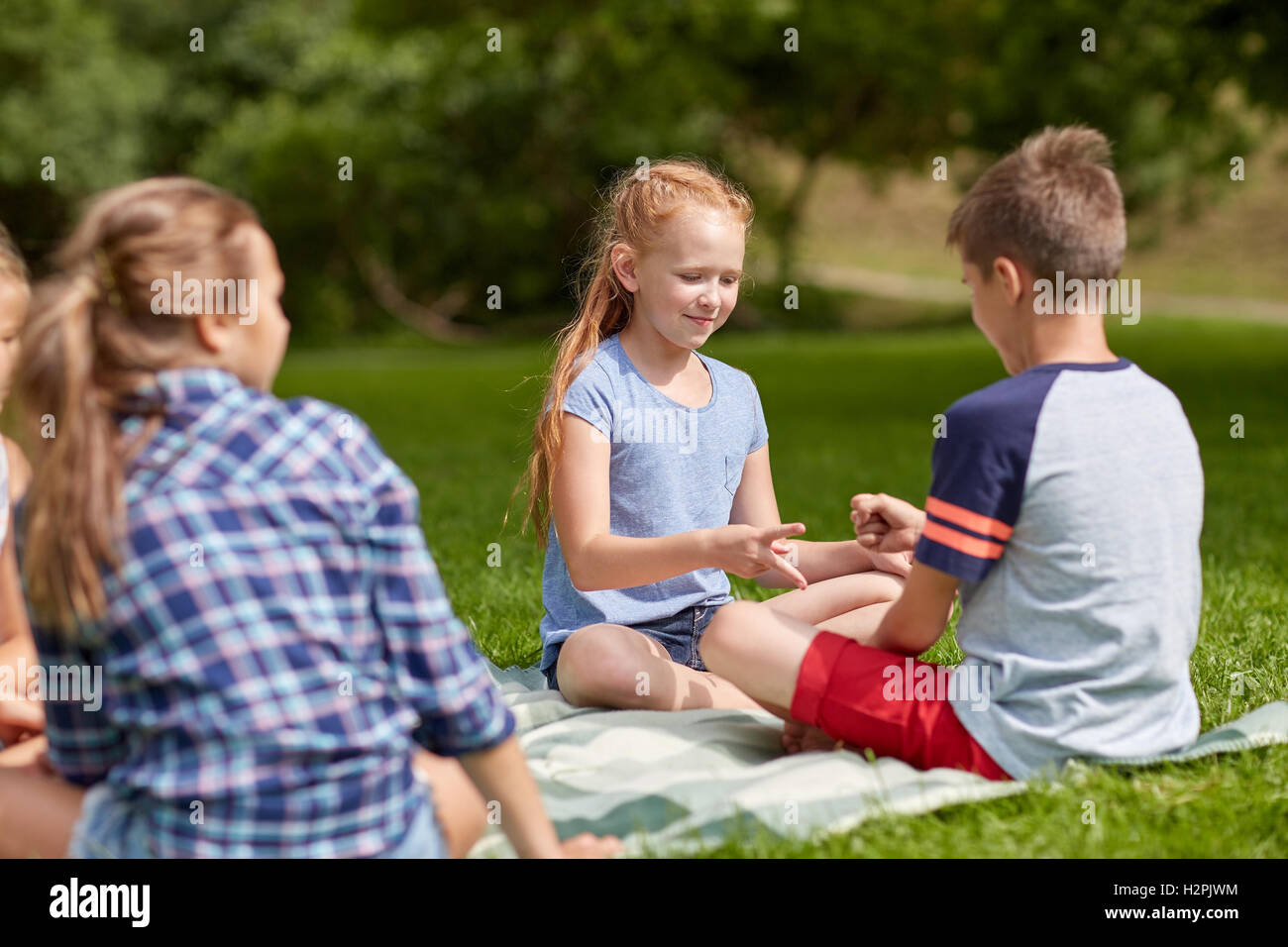 happy kids playing rock-paper-scissors game Stock Photo - Alamy